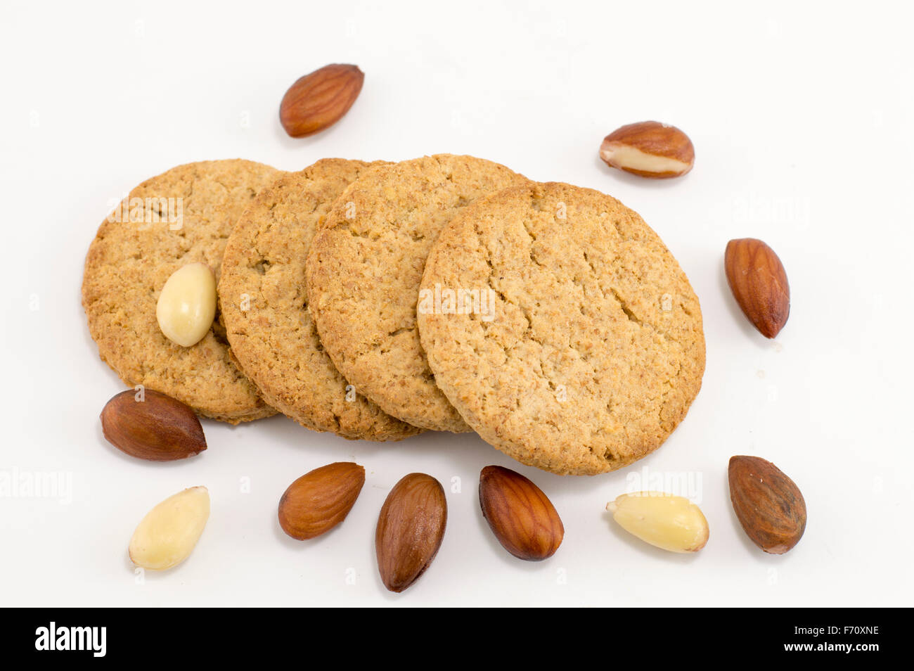 Bunch of integral cookies with almonds on white background Stock Photo ...