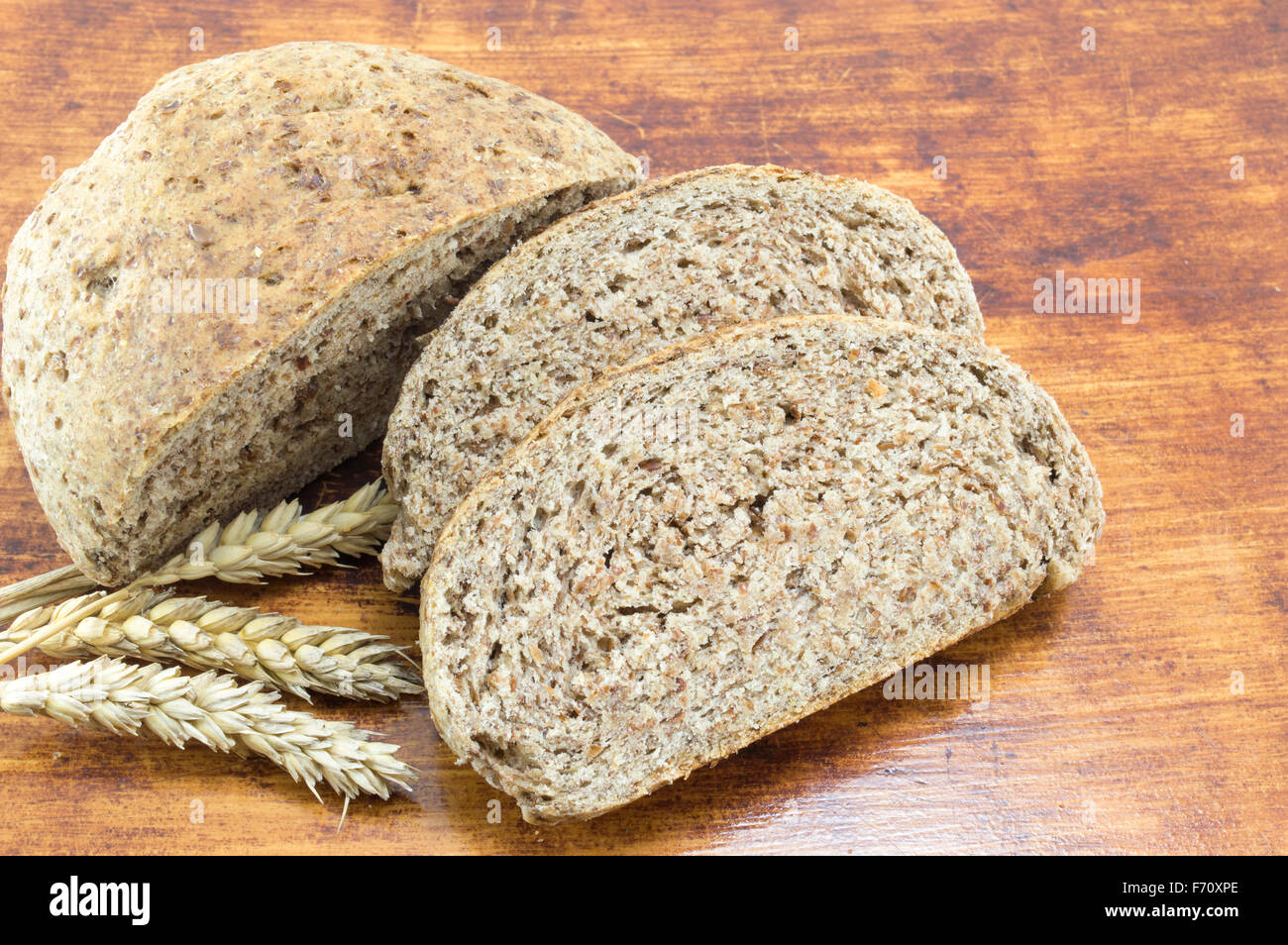 Home baked integral brown bread slices on the table Stock Photo - Alamy