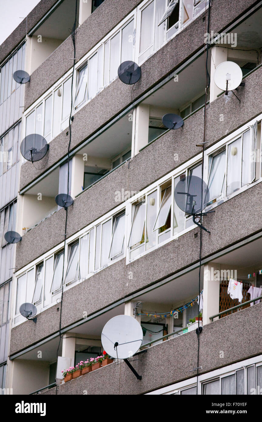 Satellite dishes on side of block of high rise flats on a council ...