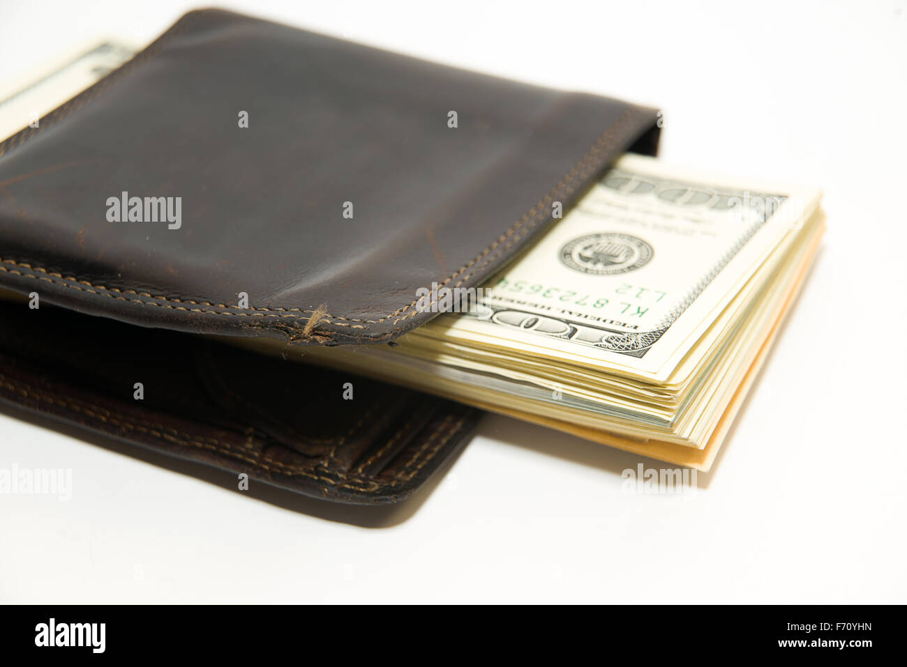Old leather wallet with banknotes of US dollars inside Stock Photo - Alamy