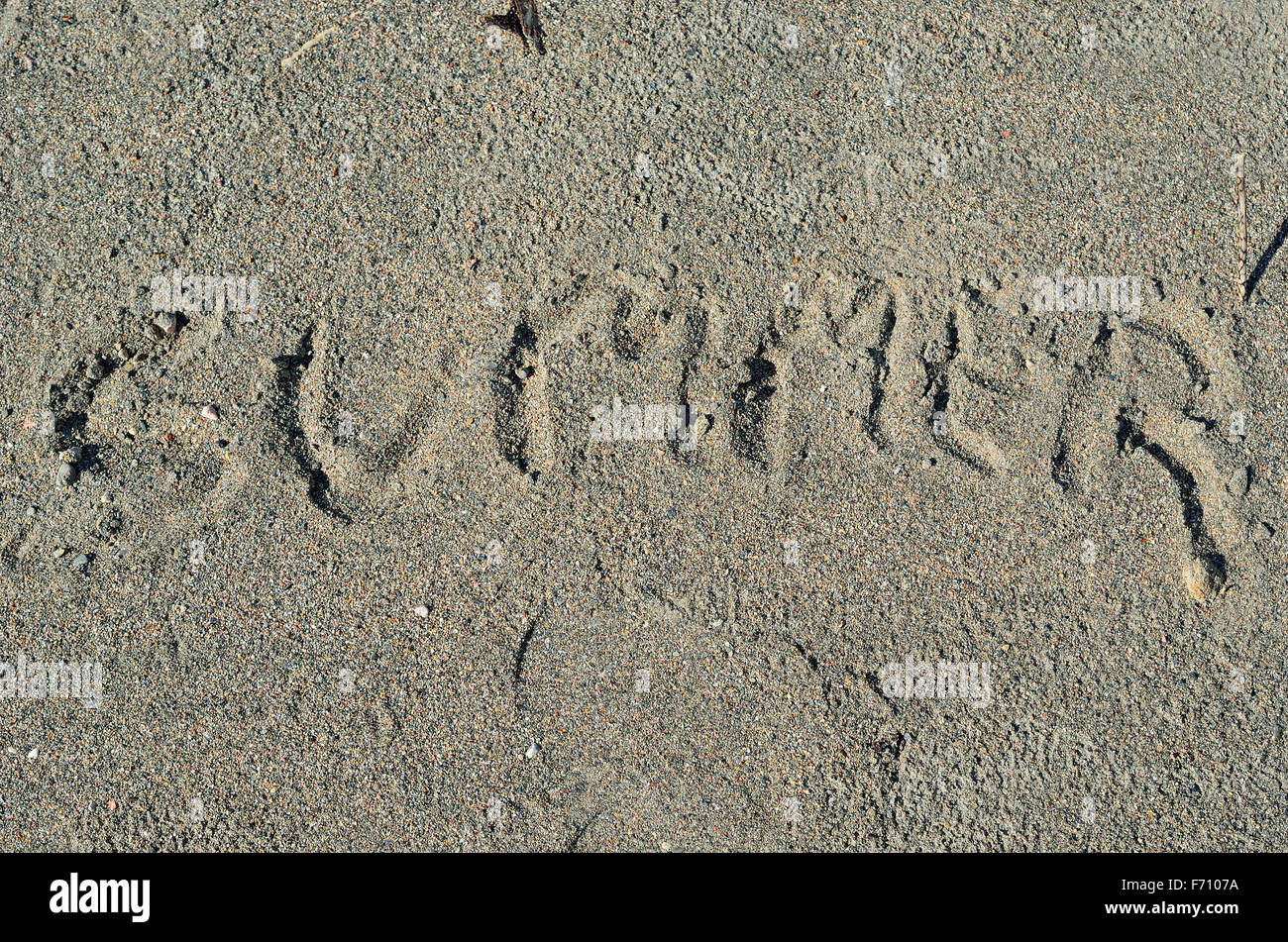 summer written in beach sand Stock Photo - Alamy