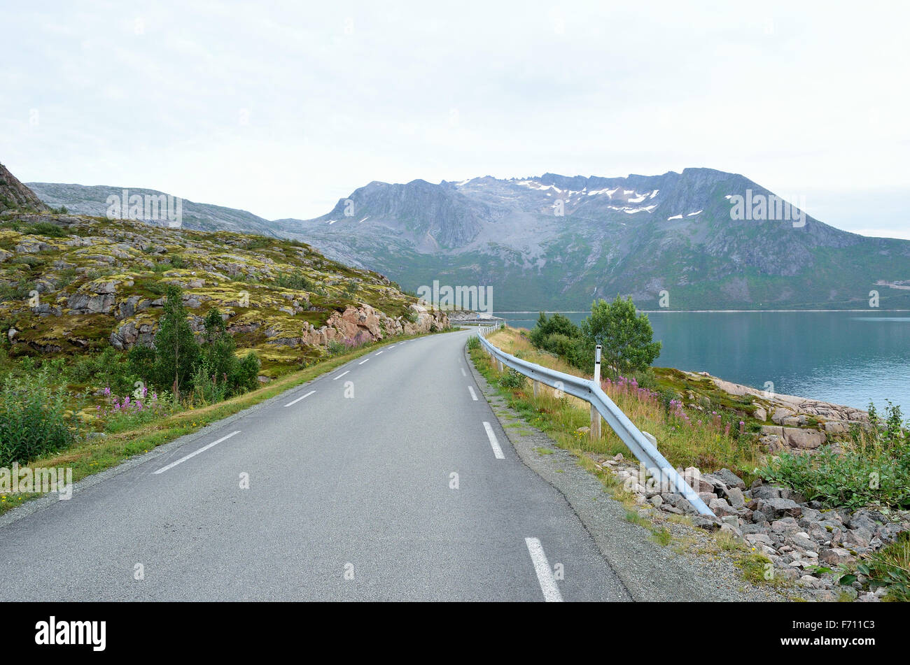 long road beside sea shore and mountain in summer Stock Photo - Alamy