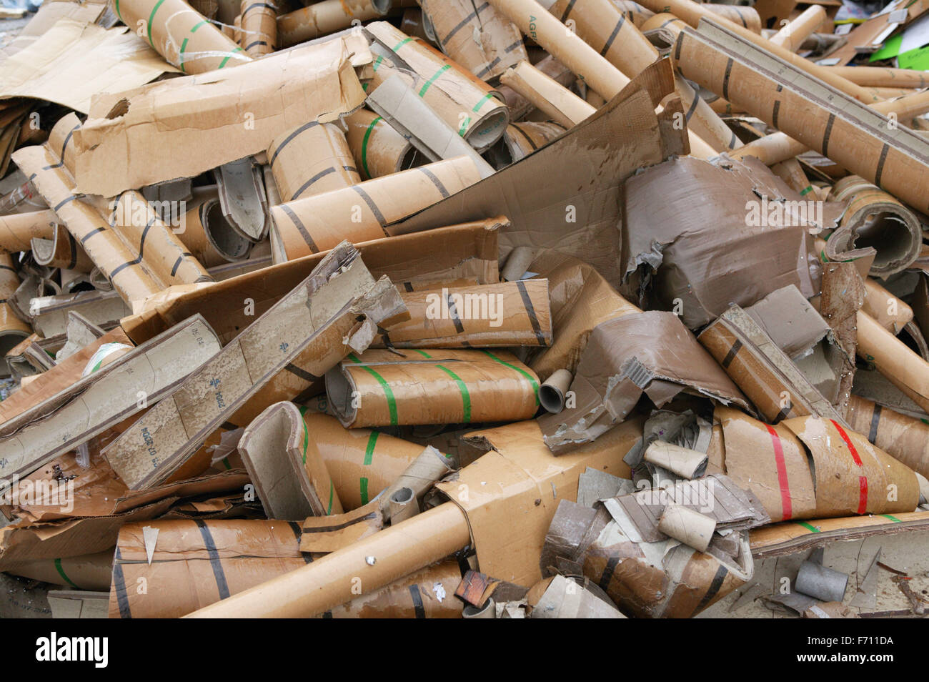 Pile of cardboard waste to be sorted for recycling Stock Photo - Alamy