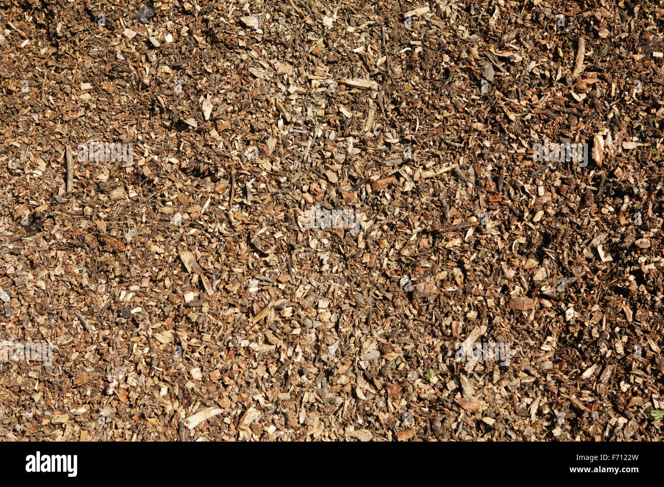 Close up of shredded green waste to be used on top of soil in landscape ...