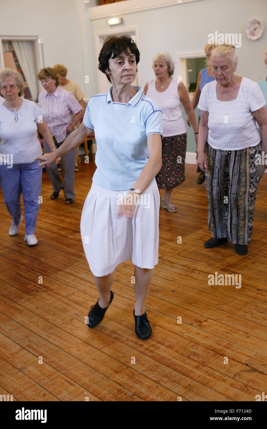 Class of elderly people doing line dancing Stock Photo - Alamy
