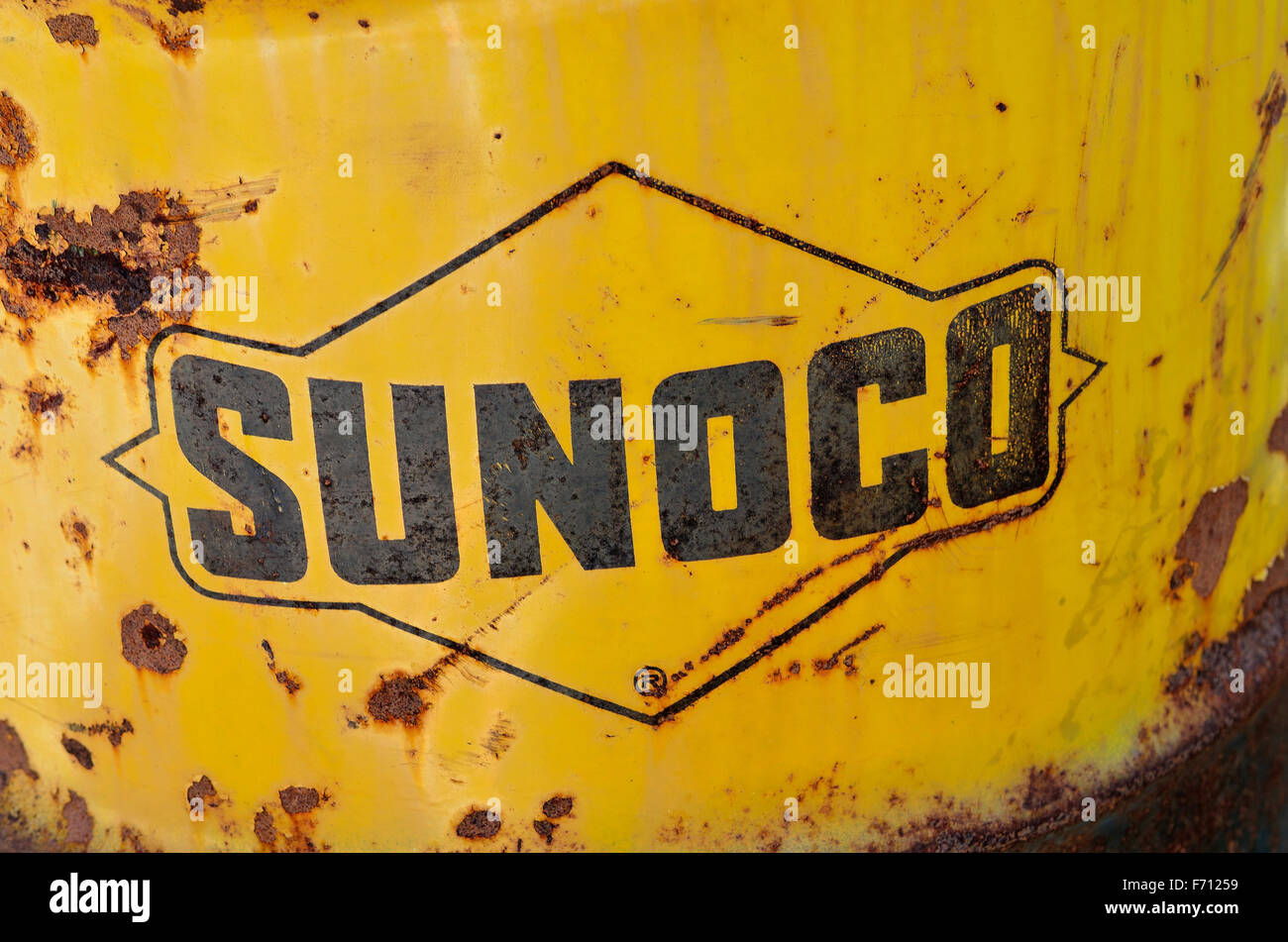 old yellow rusted sunoco barrel container Stock Photo - Alamy
