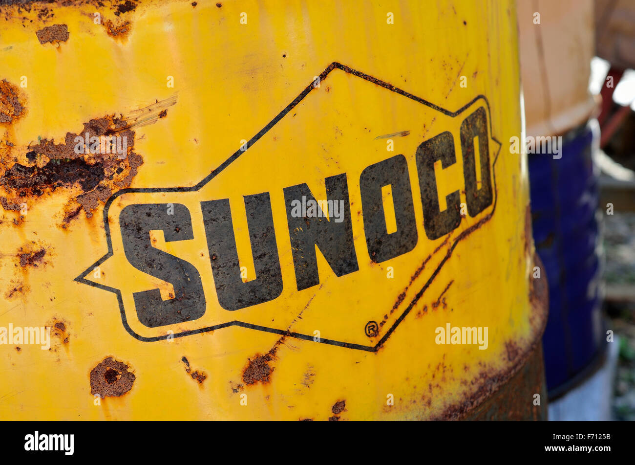 old yellow rusted sunoco barrel container Stock Photo - Alamy