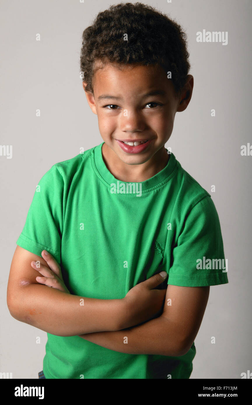 Portrait of a young boy with his arms folded Stock Photo - Alamy
