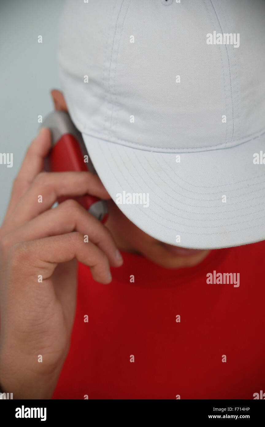 Teenage boy talking on his mobile phone Stock Photo - Alamy