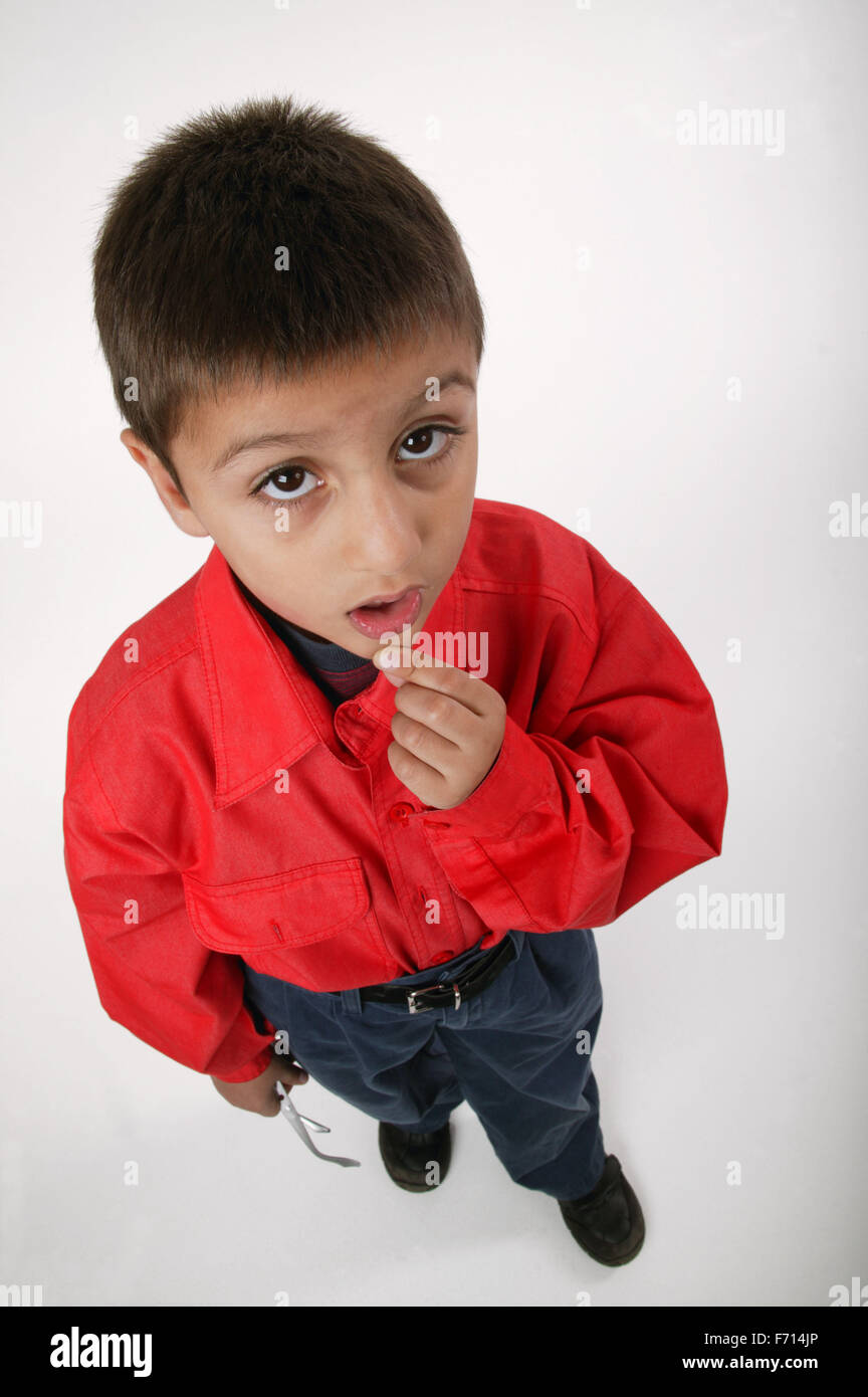Portrait of young boy standing Stock Photo - Alamy