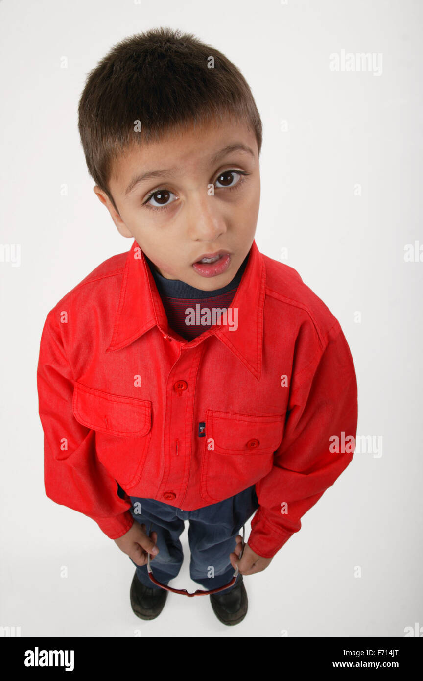 Portrait of young boy standing Stock Photo - Alamy