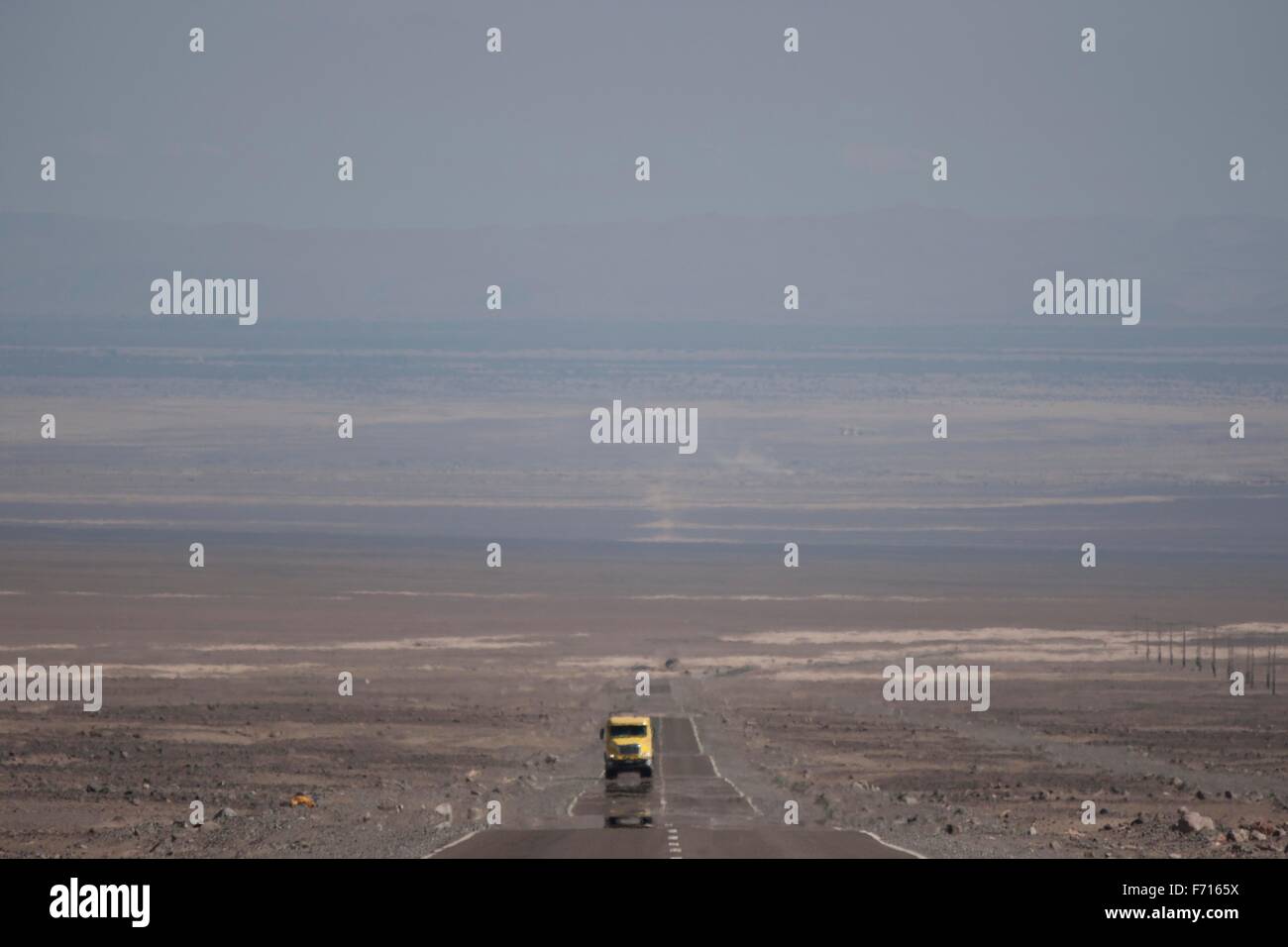 A truck drives along a road in the Atacama desert in northern Chile ...