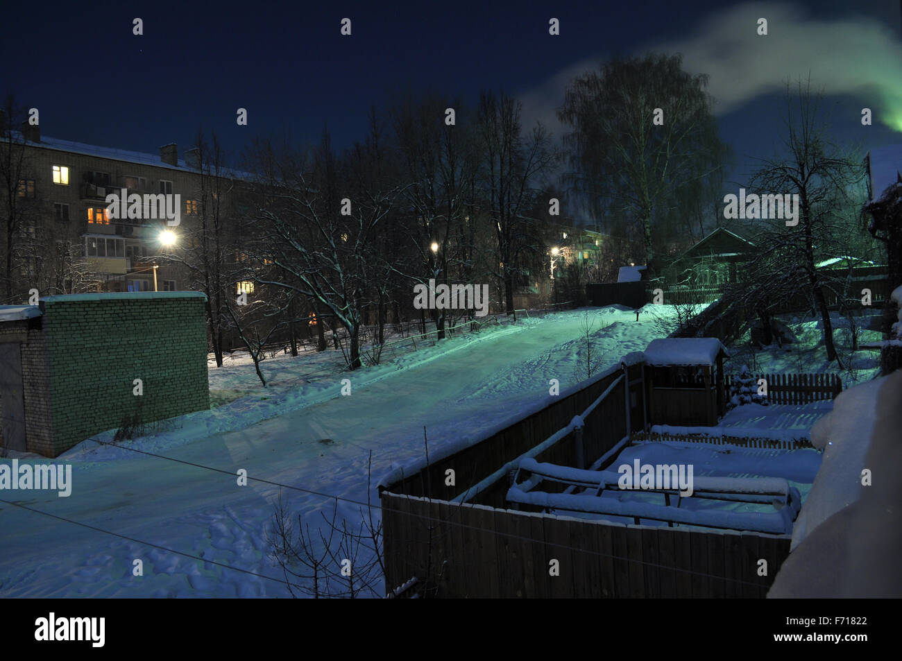 Street in the area of buildings with a mixed late winter evening ...