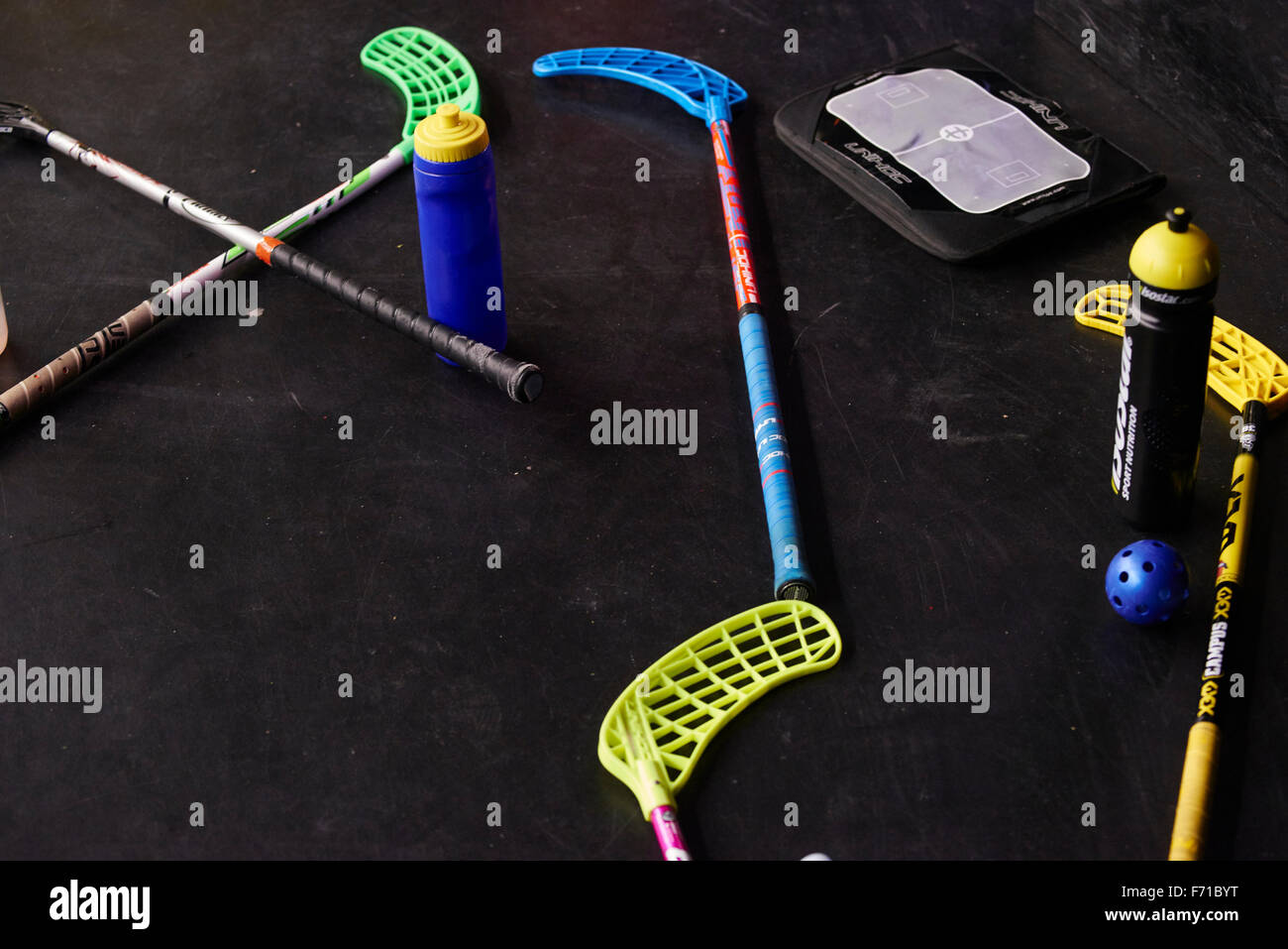 Children boys schoolchildren playing floorball (floor hockey) match in ...