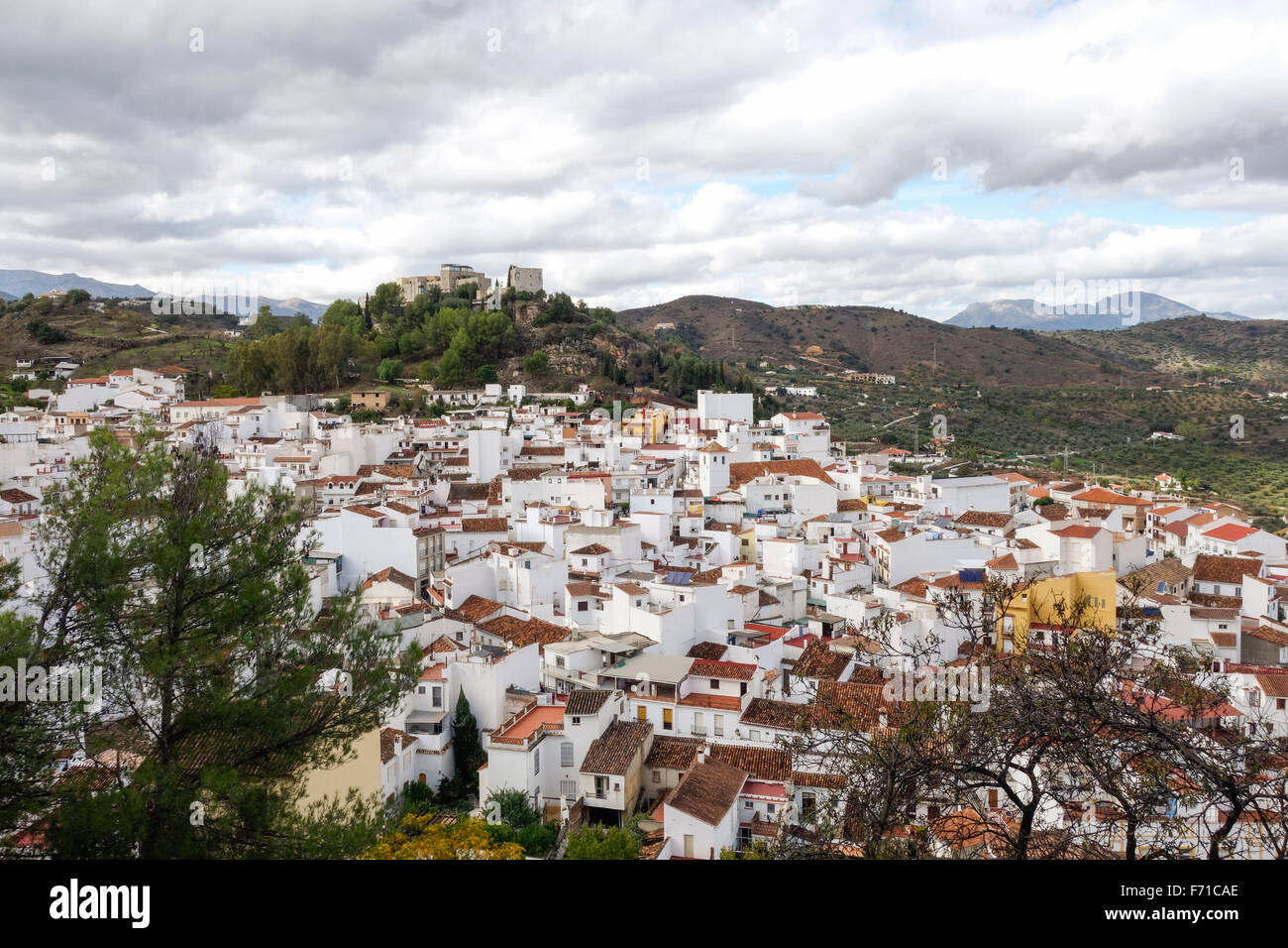 View of the white washed village of Monda with Al-Mundat Castle, Sierra ...