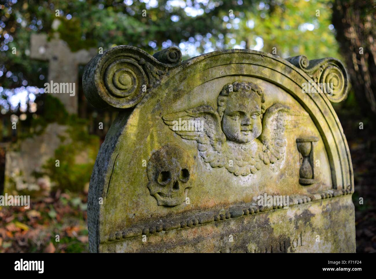 Baby faced cherub figure on a headstone at St. Nicholas churchyard ...