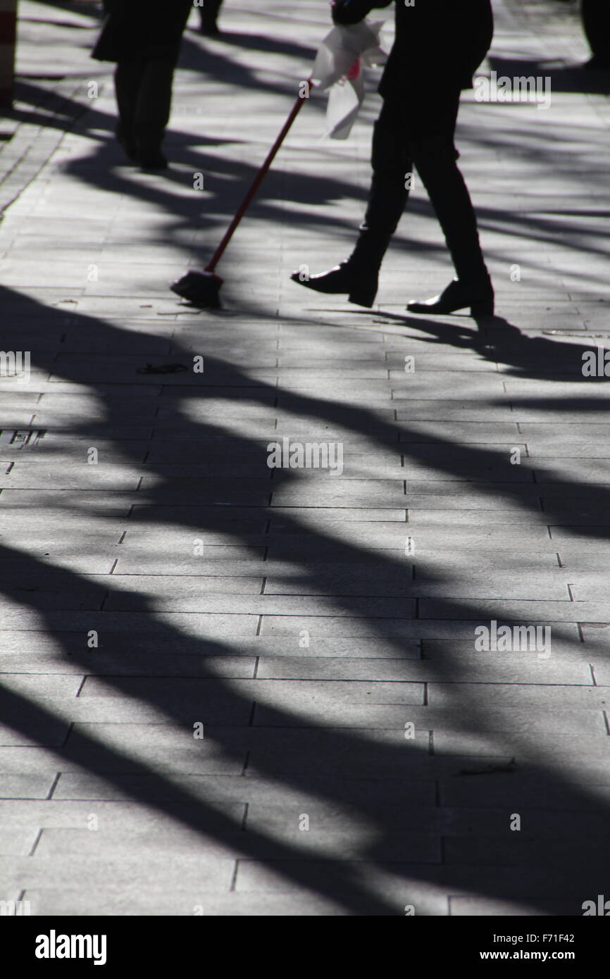 Woman sweeping street hi-res stock photography and images - Alamy