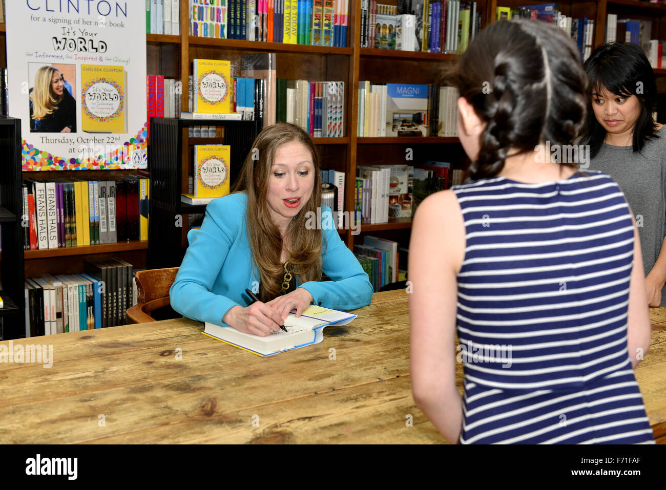 Chelsea Clinton signs copies of her new book 'It's Your World: Get ...