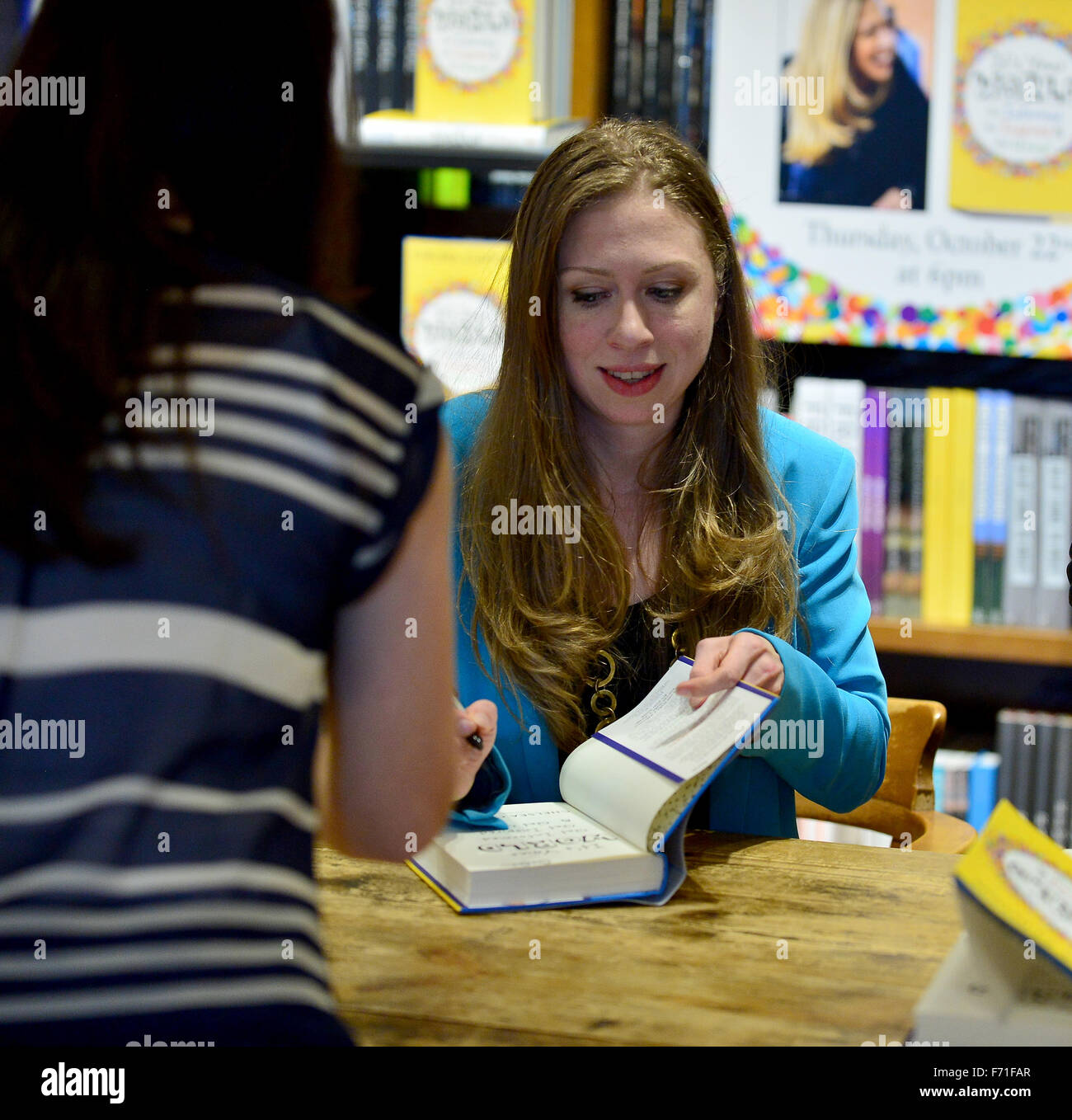Chelsea Clinton signs copies of her new book 'It's Your World: Get ...