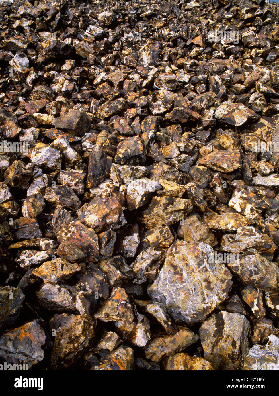 Discarded rock showing the vibrant colours of the Parys Mountain copper ...