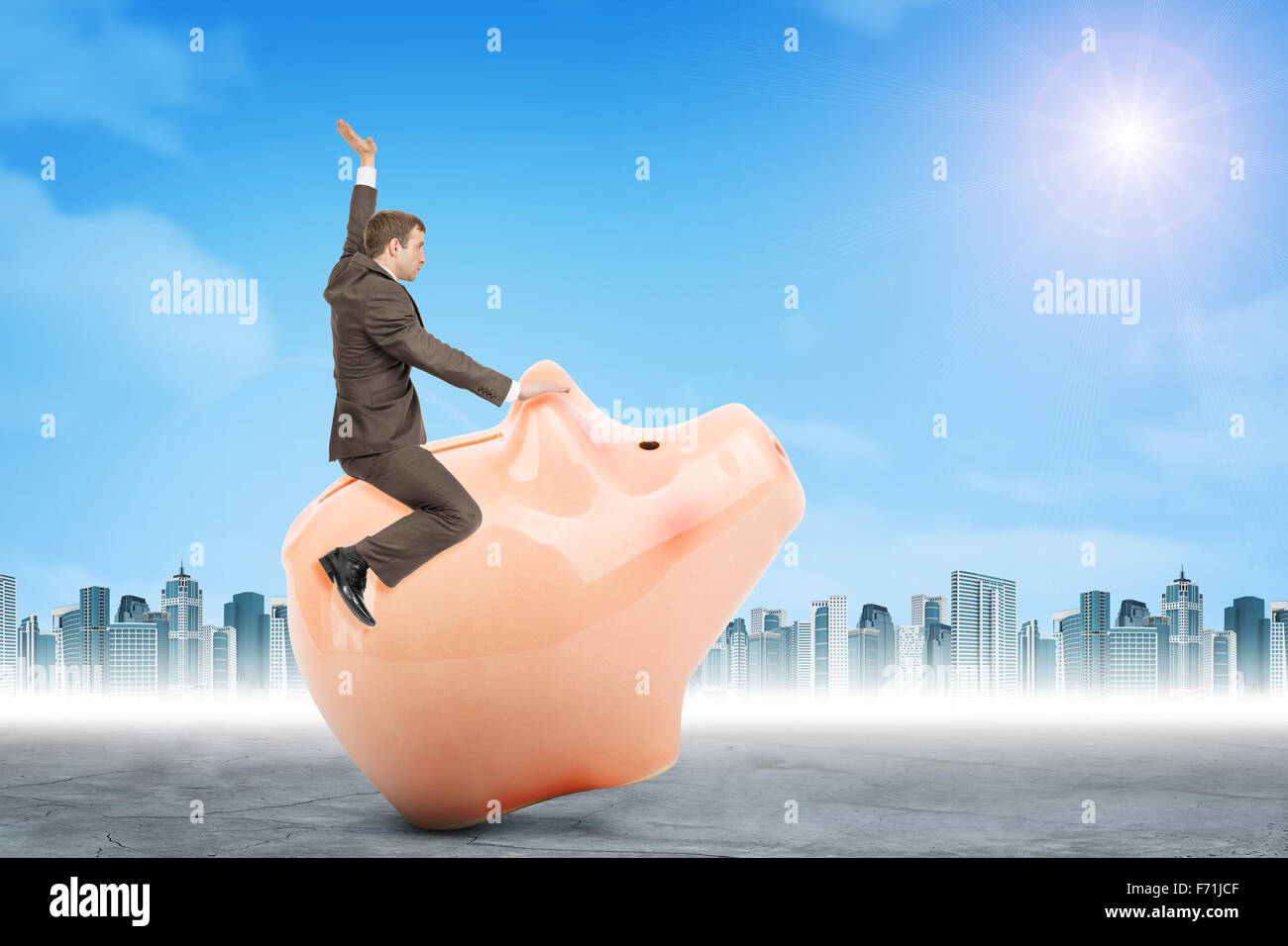 Businessman sitting on piggy bank, side view Stock Photo - Alamy