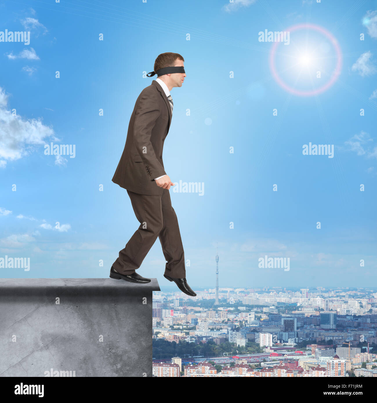 Businessman walking from edge of building roof Stock Photo - Alamy
