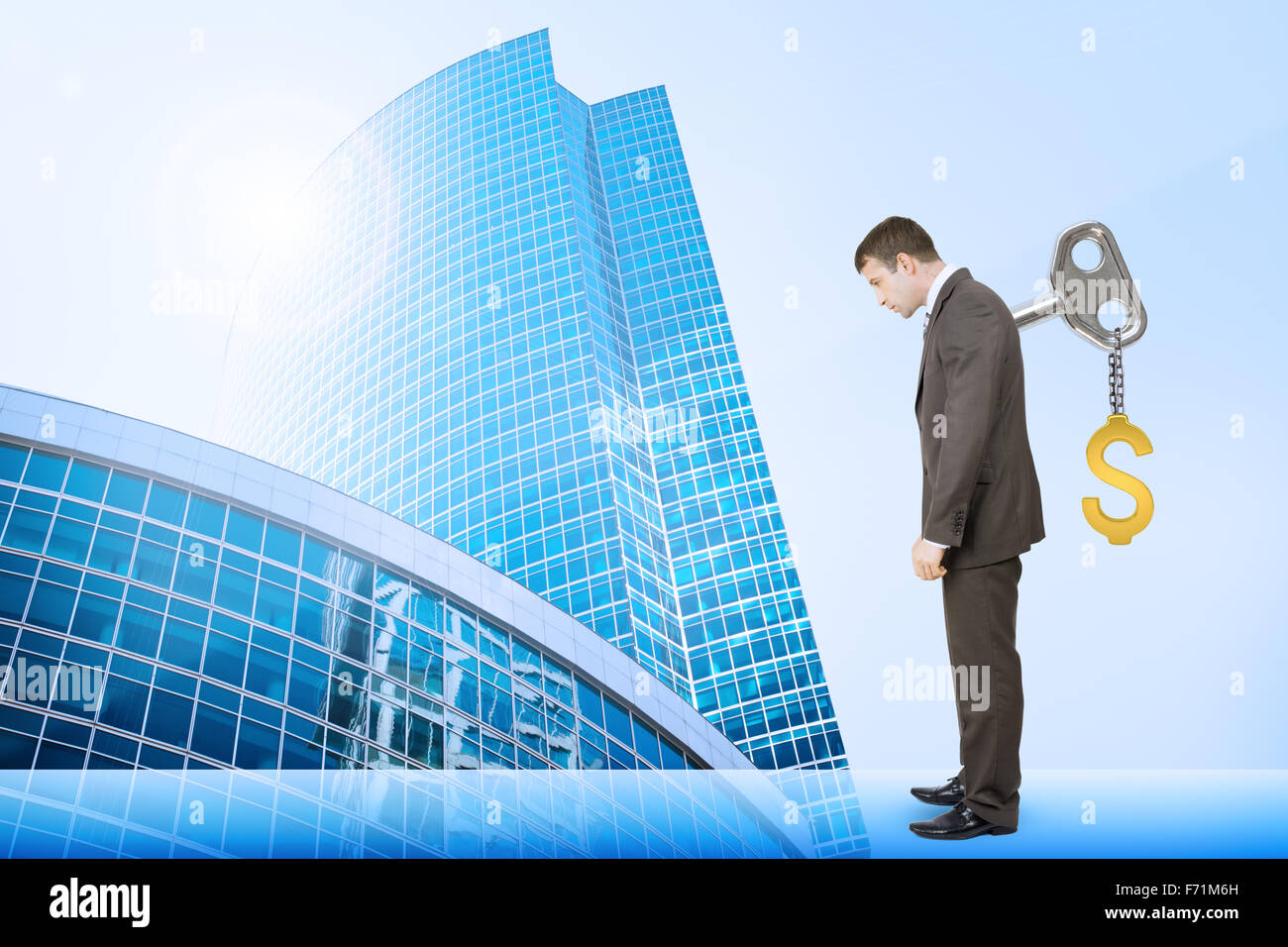 Businessman with key in back and cityscape Stock Photo - Alamy