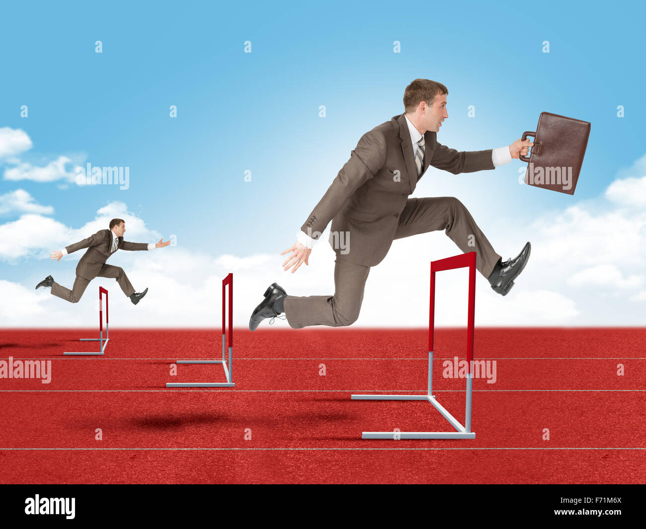 Man hopping over red treadmill barrier Stock Photo - Alamy