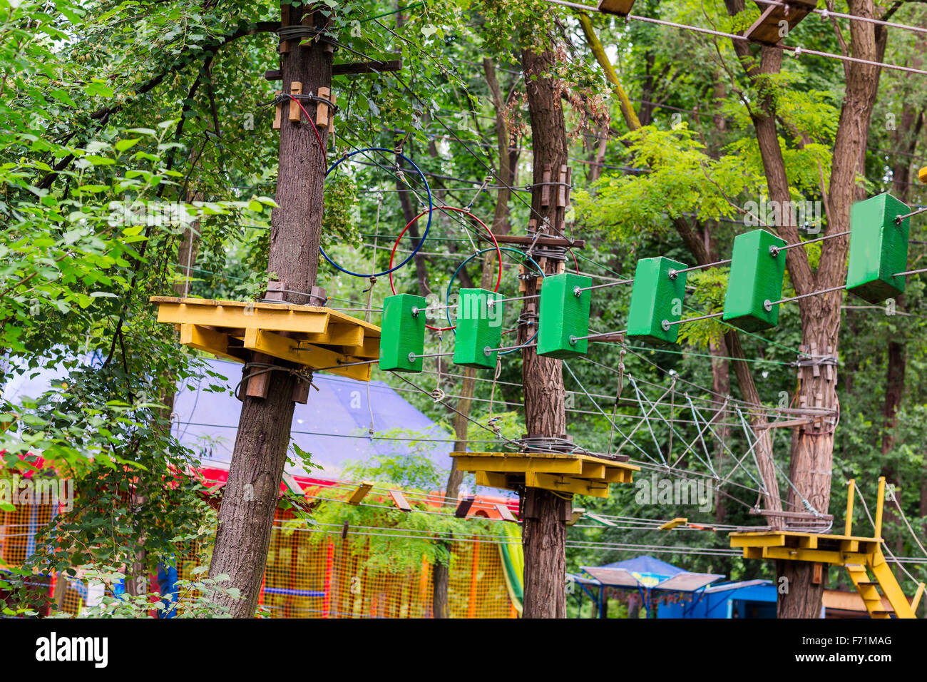 Adventure climbing high wire park, rope extreme park Stock Photo - Alamy