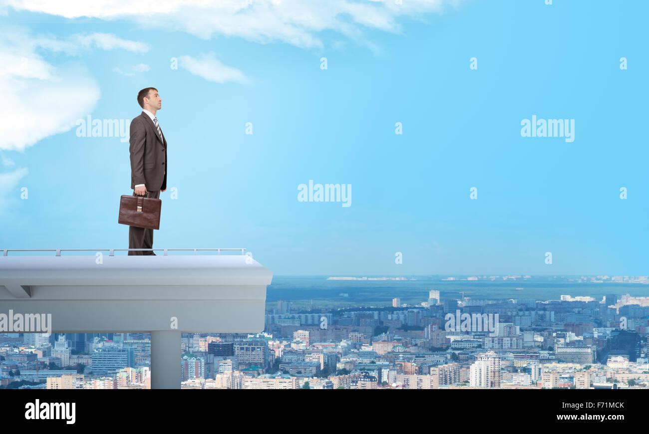 Man standing edge roof hi-res stock photography and images - Alamy