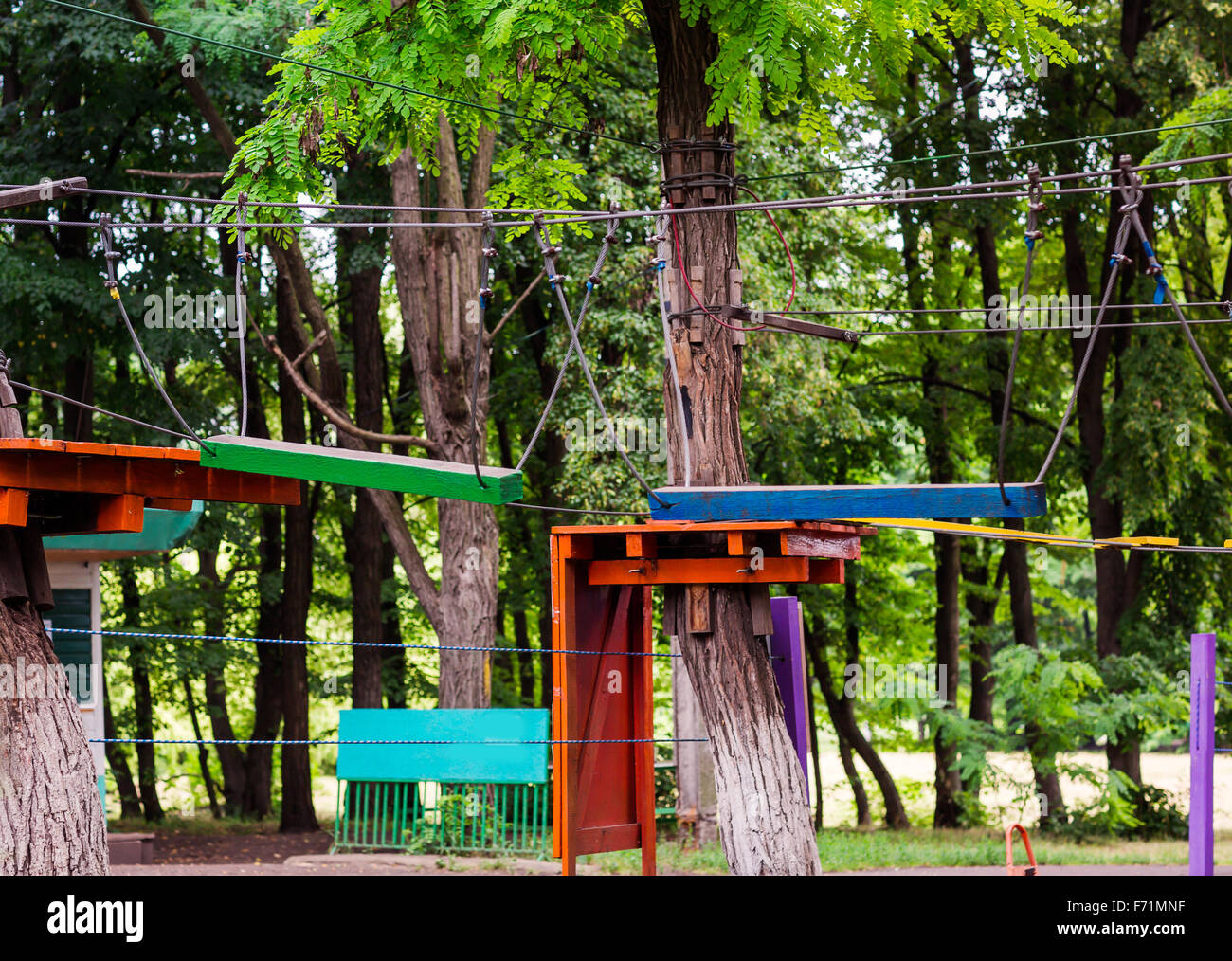 Adventure climbing high wire park, rope extreme park Stock Photo - Alamy