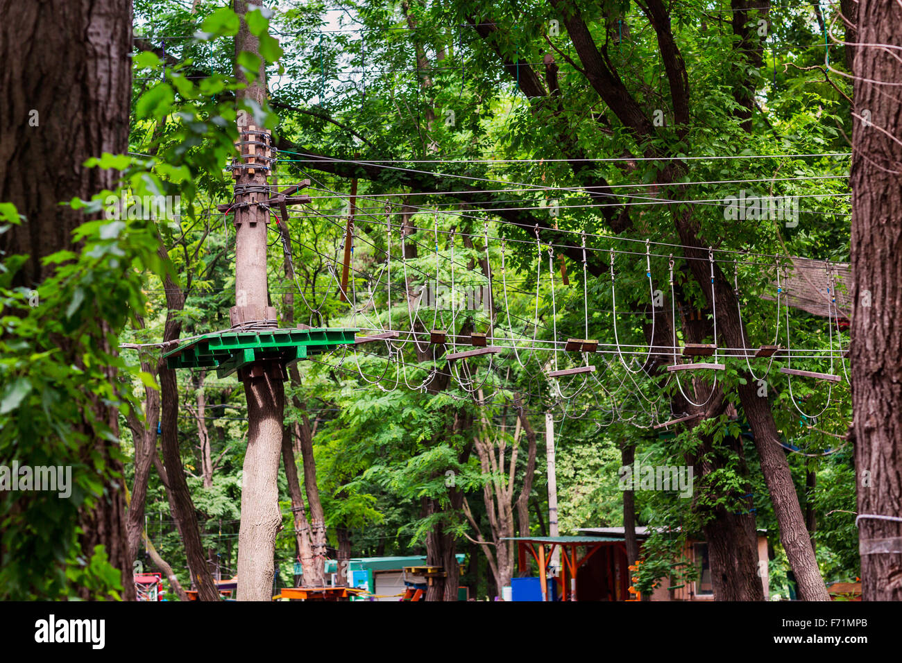 Adventure climbing high wire park, rope extreme park Stock Photo - Alamy