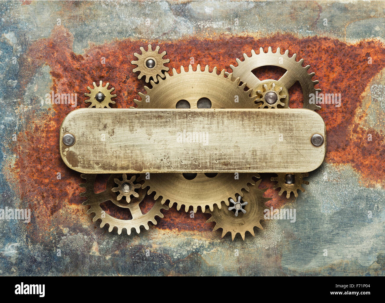 Clockwork mechanism on rusty background made of metal gears and brass ...