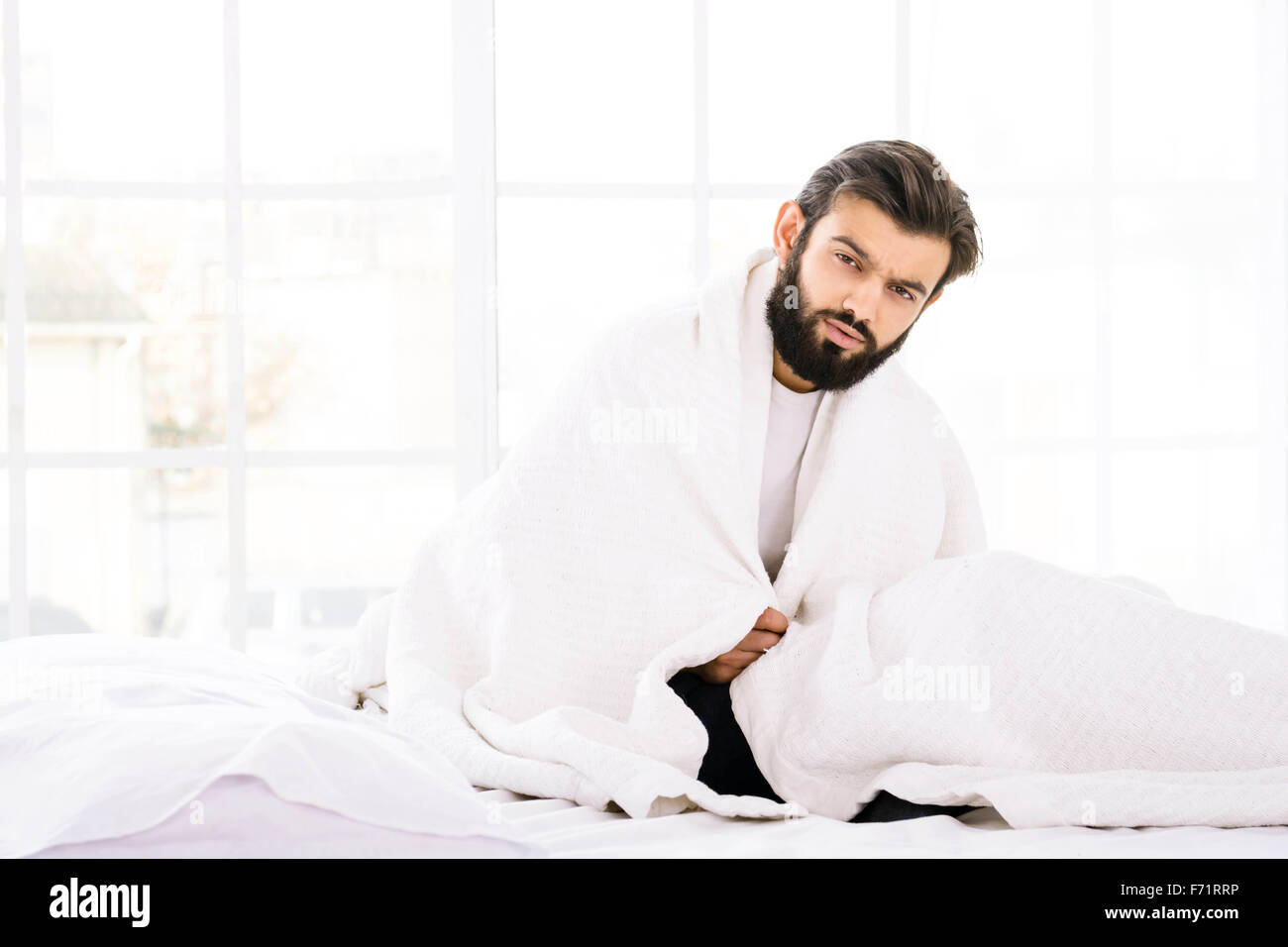 Sleepy young man in the morning Stock Photo - Alamy