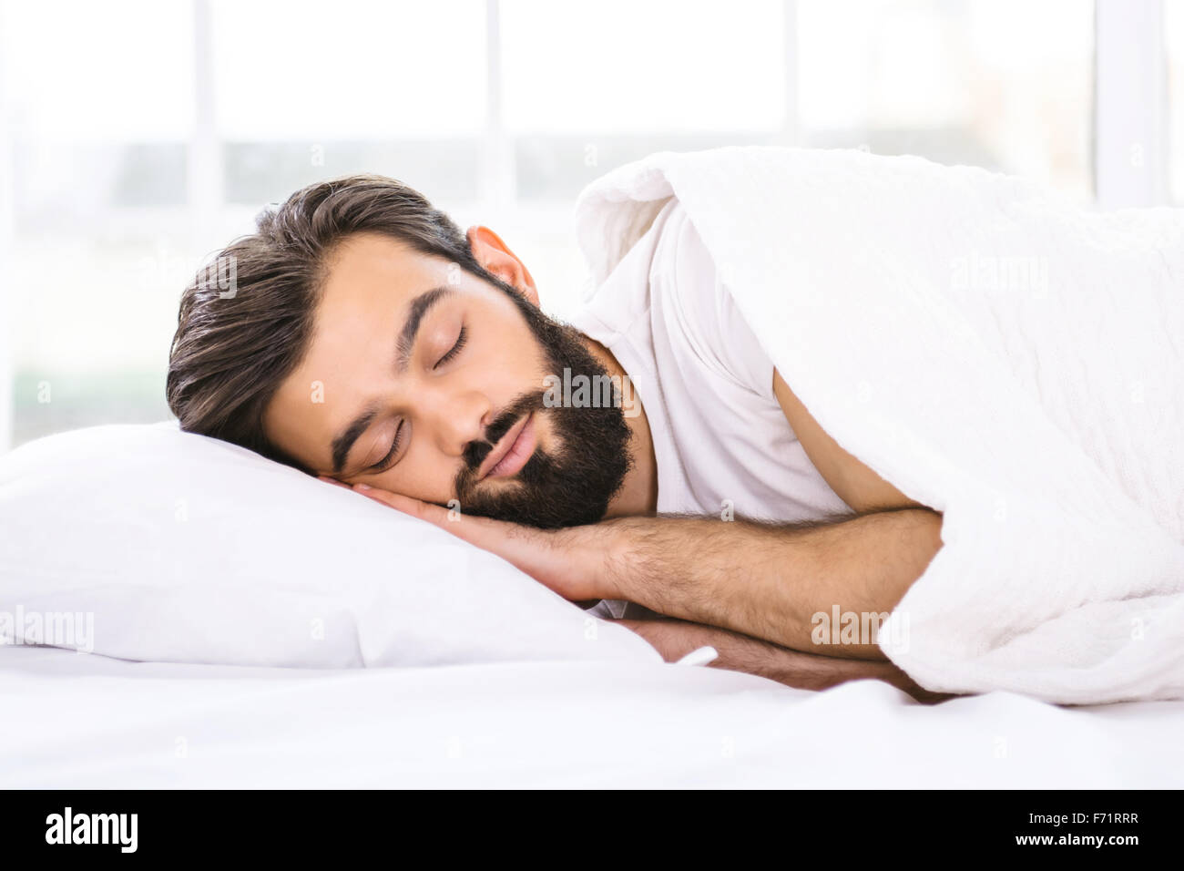 Sleepy young man in the morning Stock Photo - Alamy