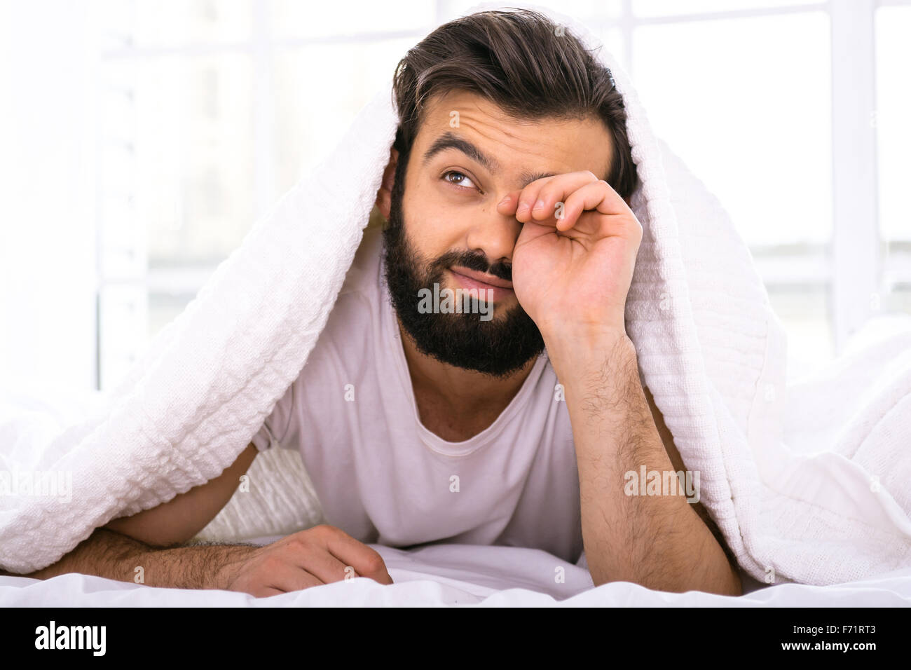 Sleepy young man in the morning Stock Photo - Alamy