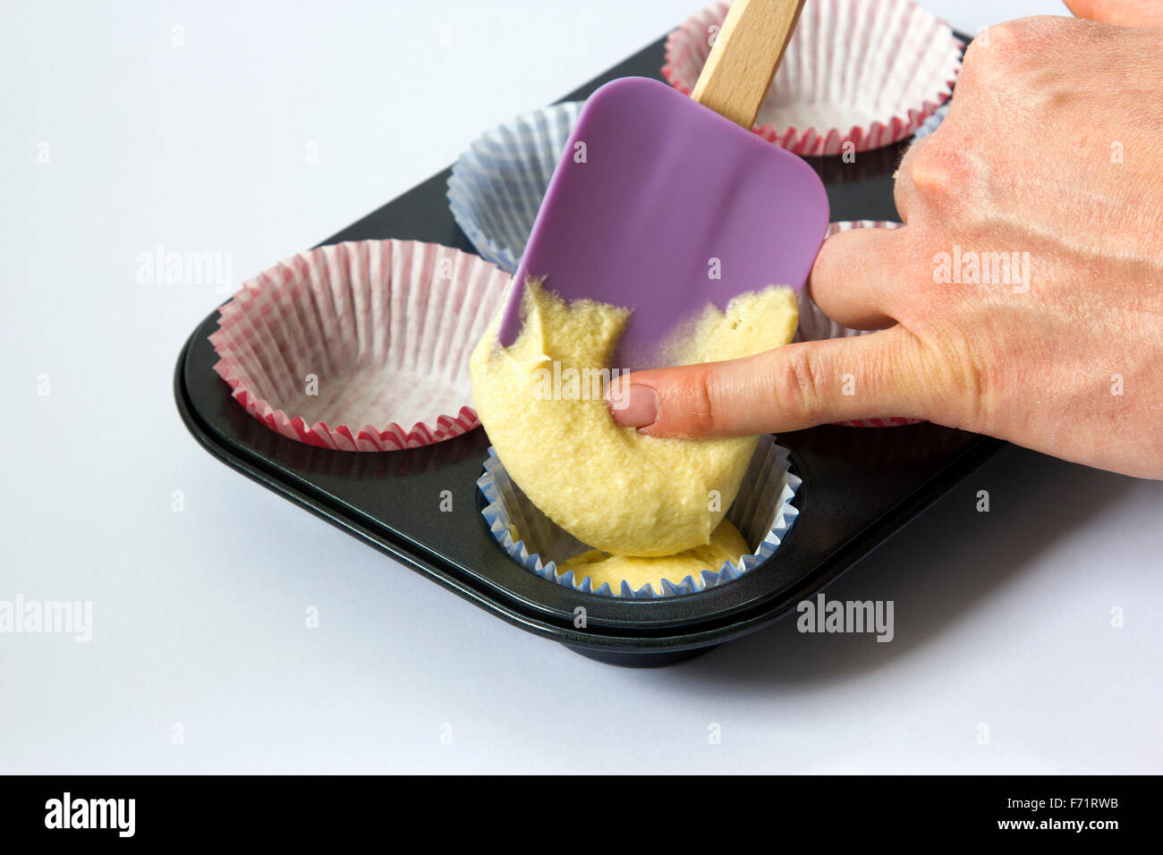 Filling cake cases hi-res stock photography and images - Alamy