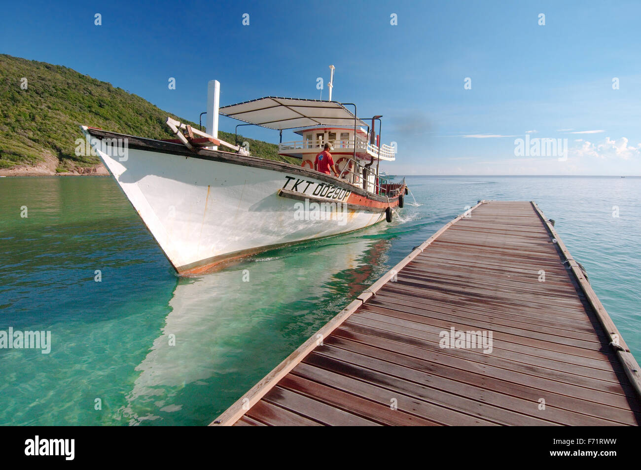 The boat is next to a wooden pier, Redang Island, Malaysia, Asia Stock ...
