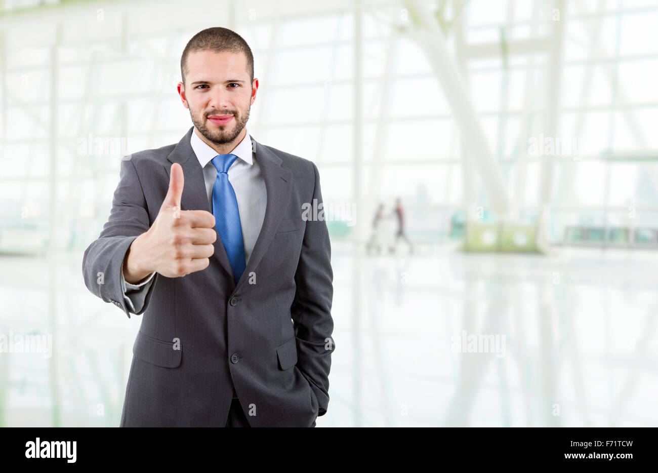 young business man going thumb up, at the office Stock Photo - Alamy