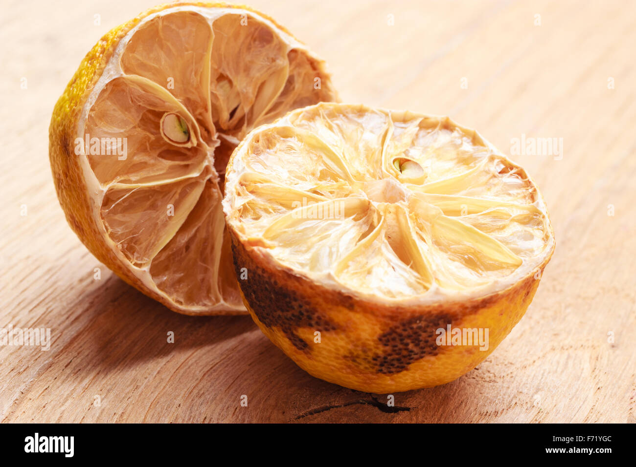 Closeup old rotten piece of lemon. Bad unhealthy food Stock Photo - Alamy