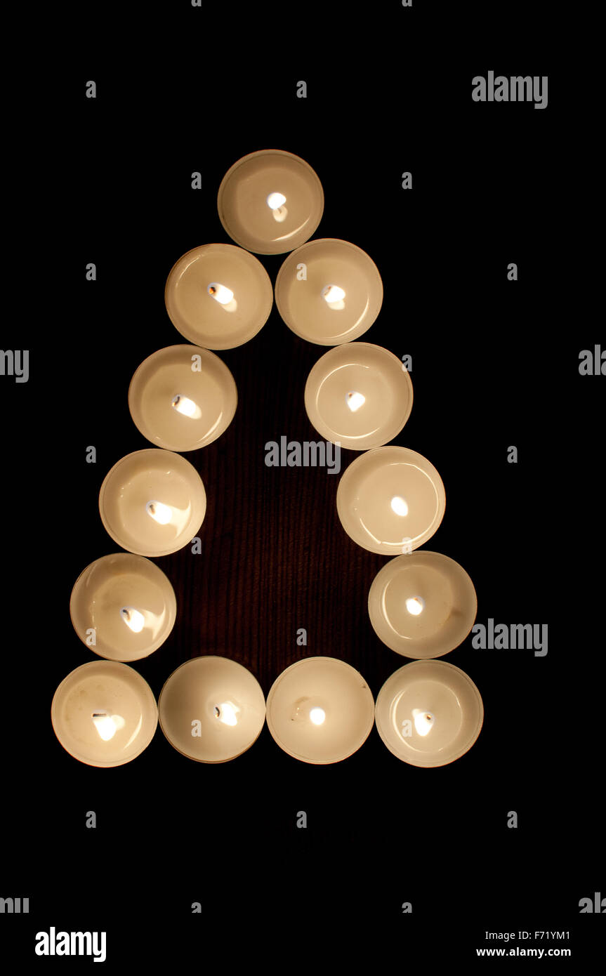 tea lights in shape of a triangle Stock Photo - Alamy
