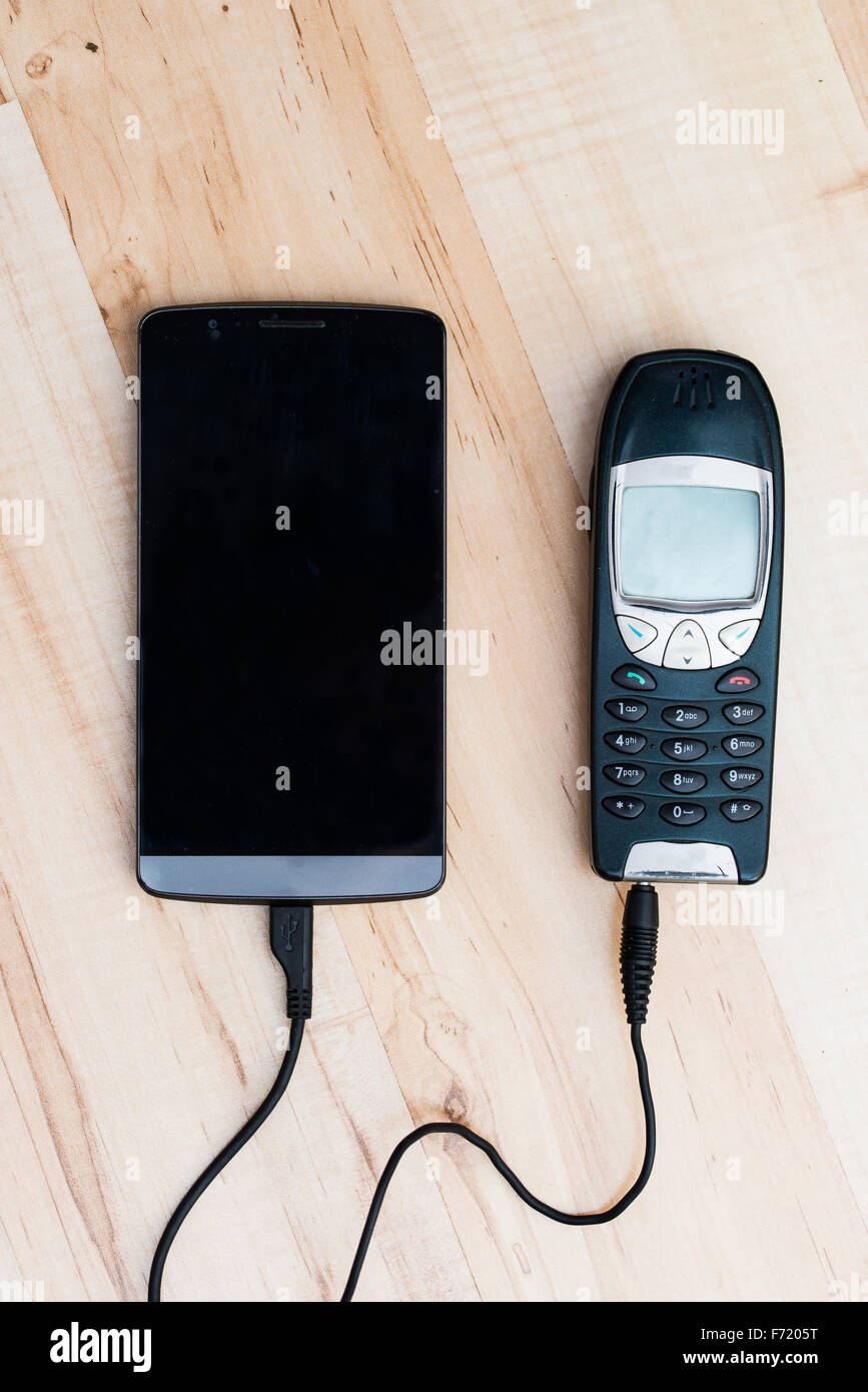 two mobile phones - modern and obsolete Stock Photo - Alamy