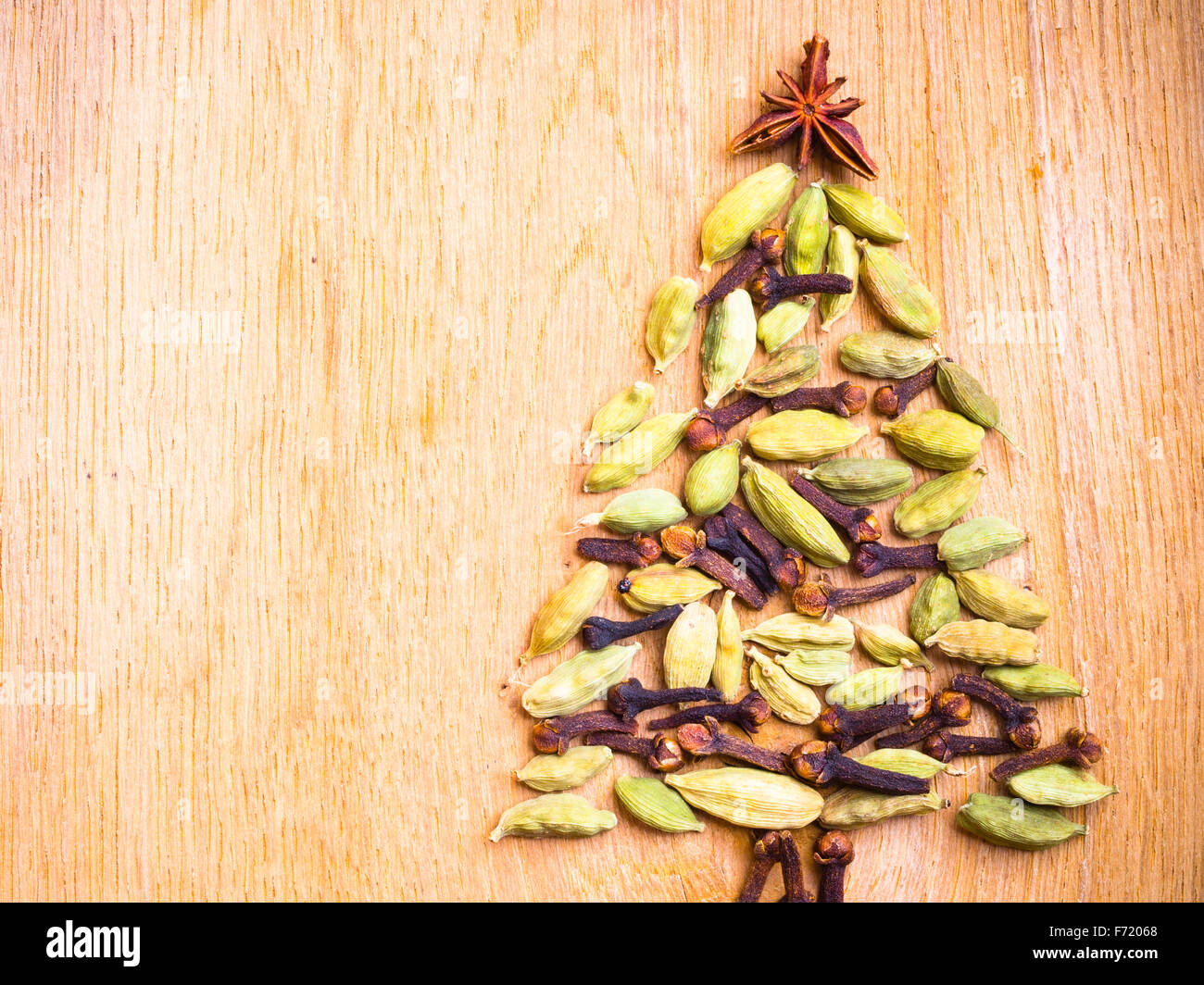 Christmas tree made from spices anise star cardamon pods and cloves on ...