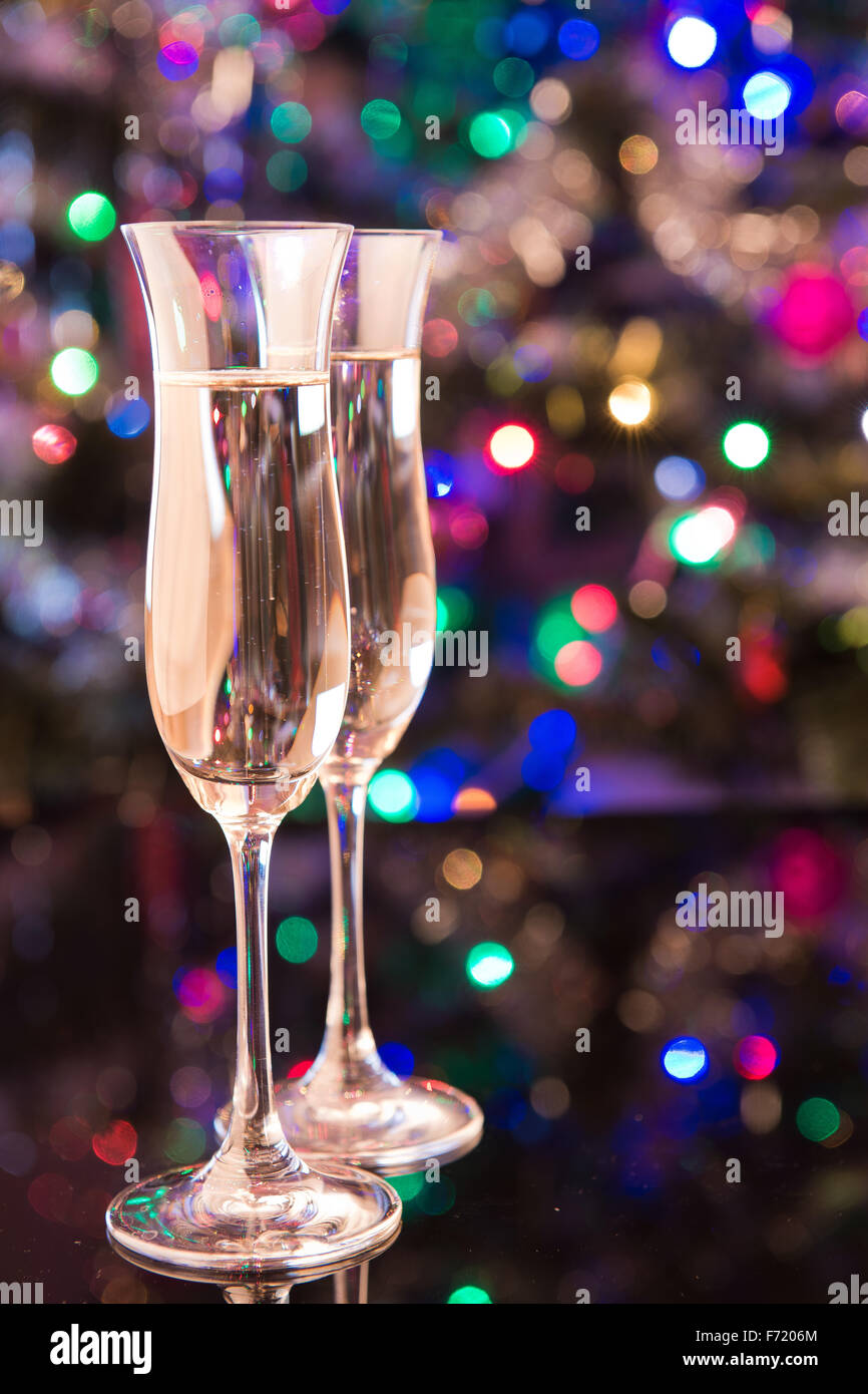two glasses of champagne on shiny background Stock Photo - Alamy