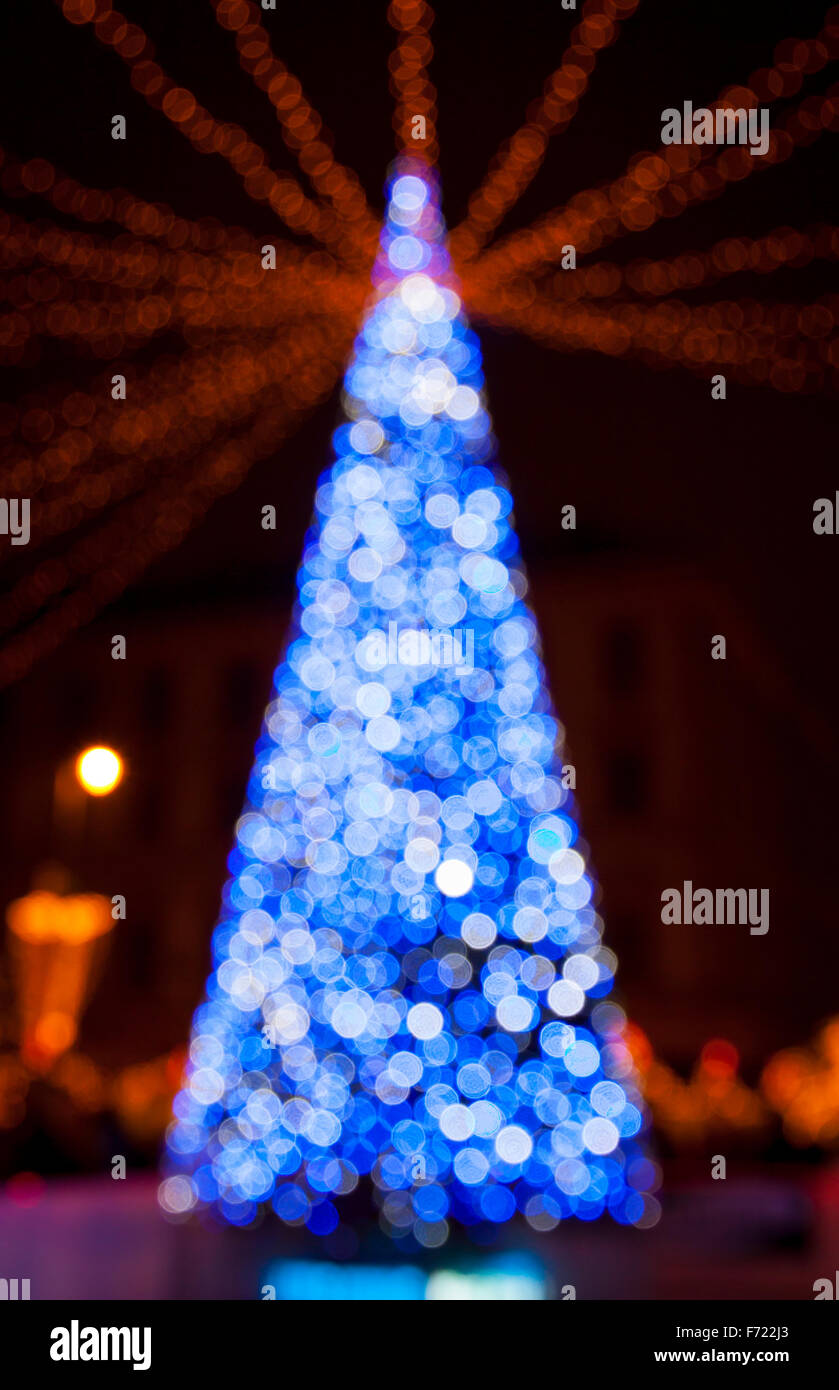New Year's tree made from blue bokeh lights Stock Photo - Alamy