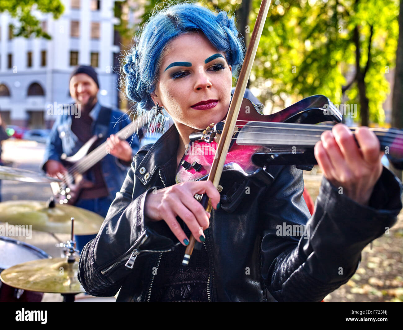 Music street performers with girl violinist Stock Photo - Alamy