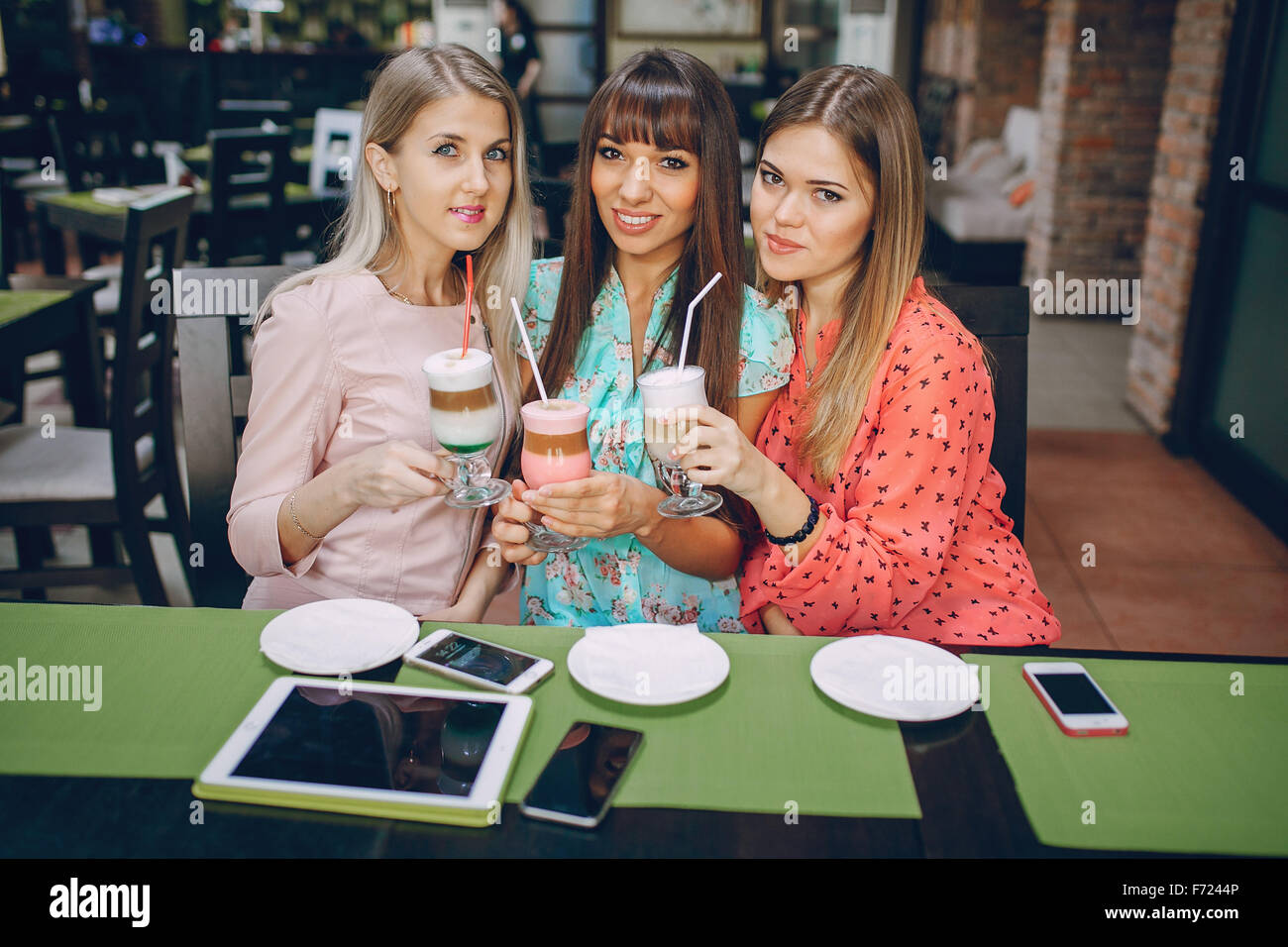 Girls with phones Stock Photo - Alamy