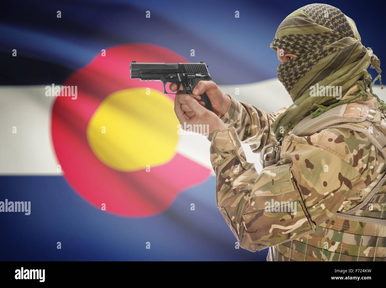 Male in muslim keffiyeh with gun in hand and flag on background series ...