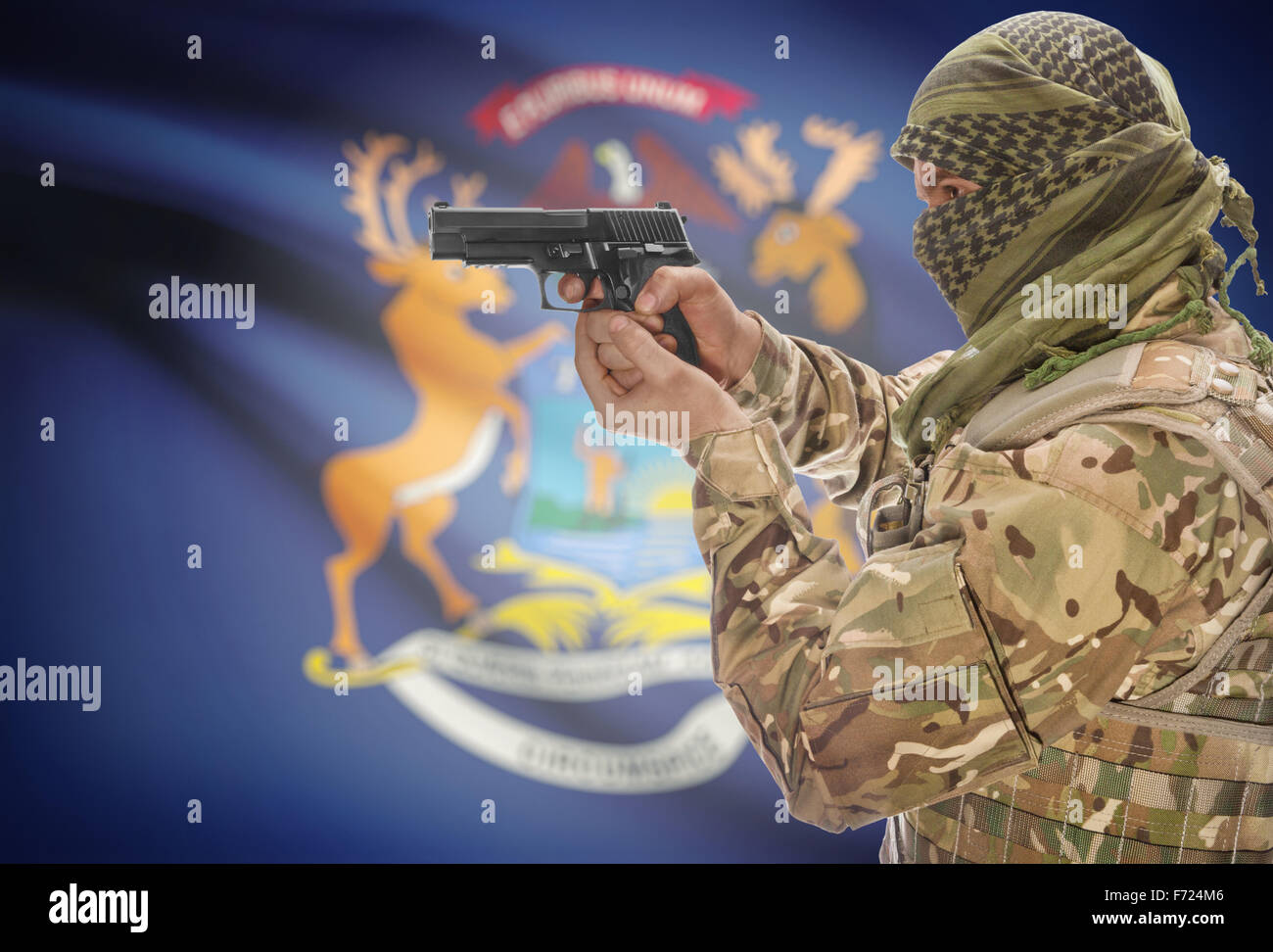 Male in muslim keffiyeh with gun in hand and flag on background series ...