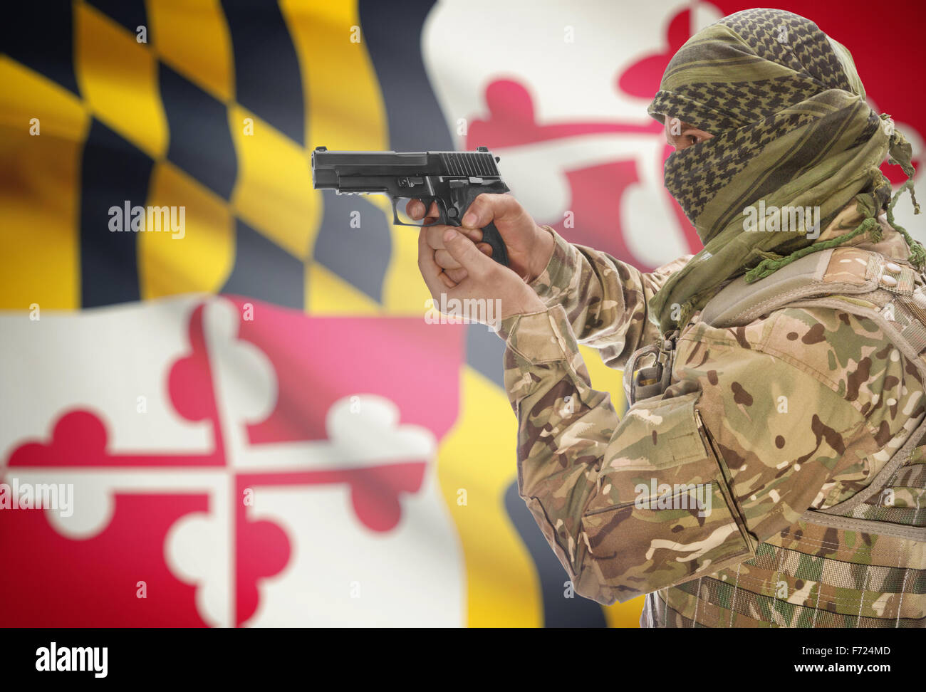 Male in muslim keffiyeh with gun in hand and flag on background series ...
